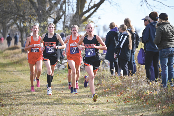 Sweeping the course: Marquette boys win easily, Redettes eke out girls ...